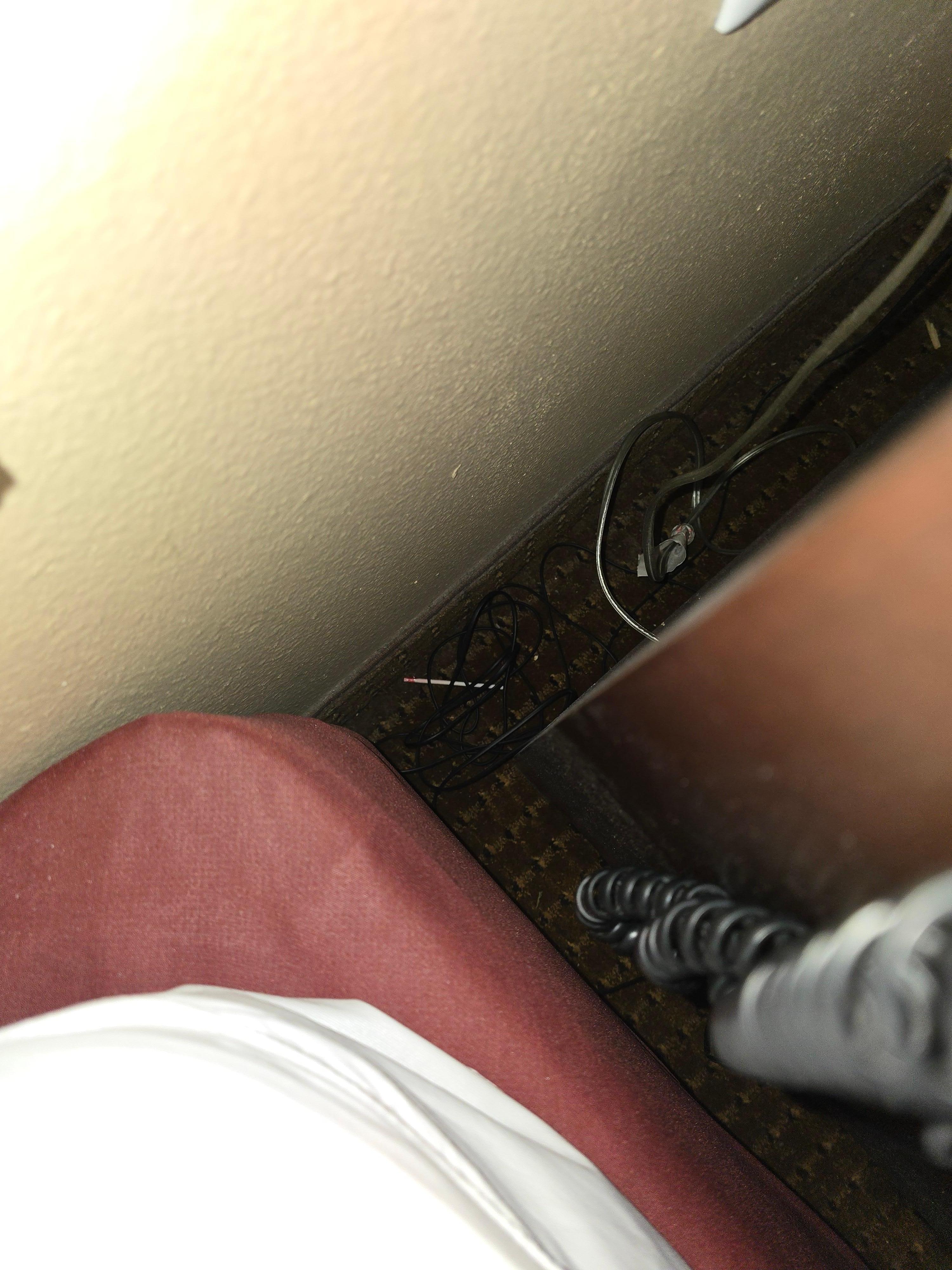 Lollipop stick behind bed stand. 