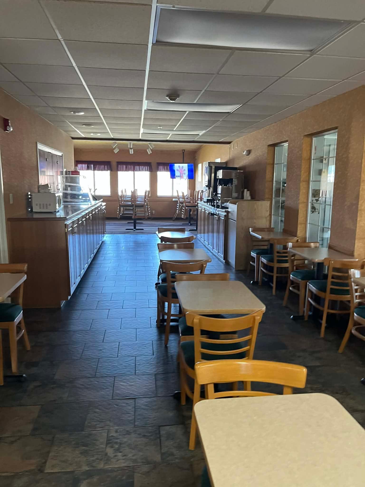 Dining area. 3 choices of juice. Hot, & cold cereal waffle maker choice of bread/bagels to toast. Hot breakfast, too!