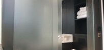 Frosted glass divider between the sleeping space and the bathroom means you can see a lot more than you might want - and hear it all too.