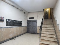 Just inside the door