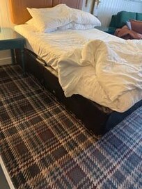 Bed base flaking and peeling which will make it difficult to clean and will harbour germs.