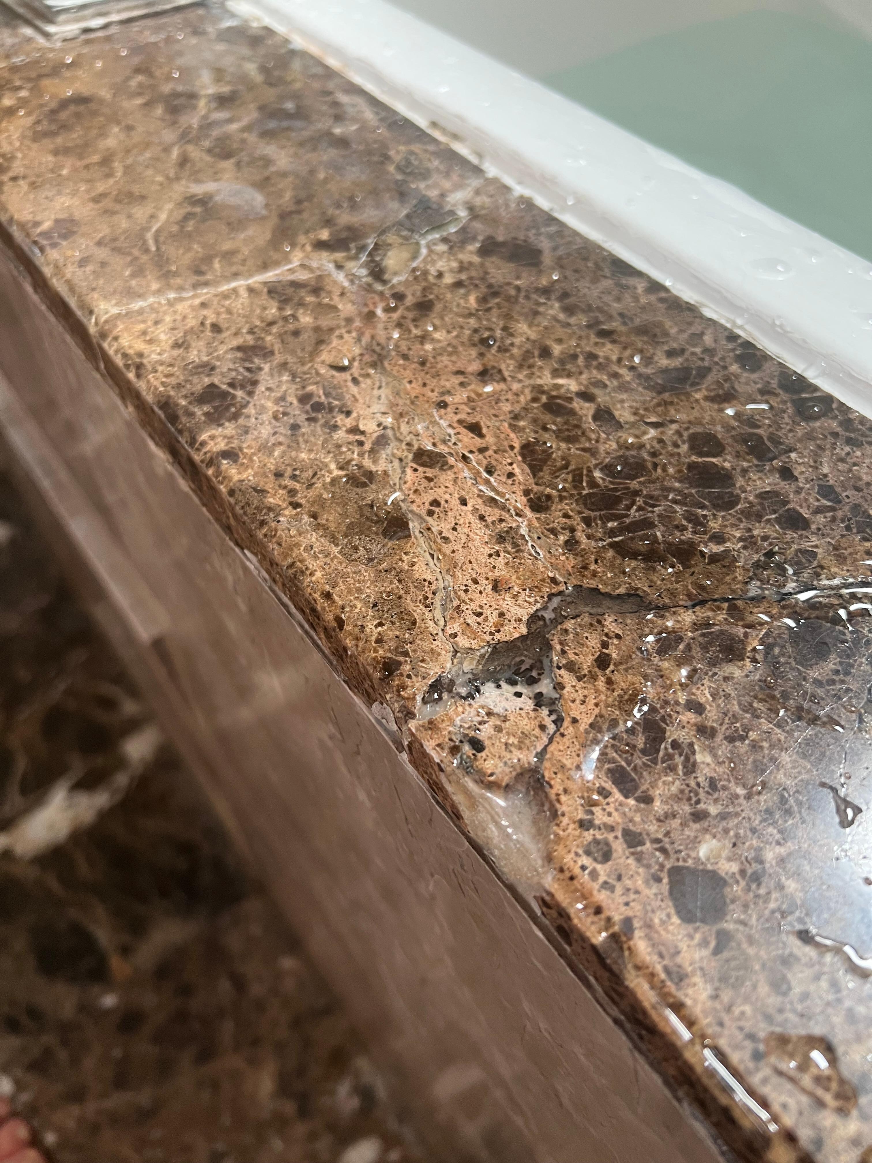 Broken sharp edges at the side of the bathtub.