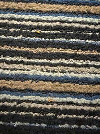 Food ceumbs on carpet