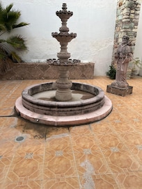 Outside the room, muddy and dry fountain