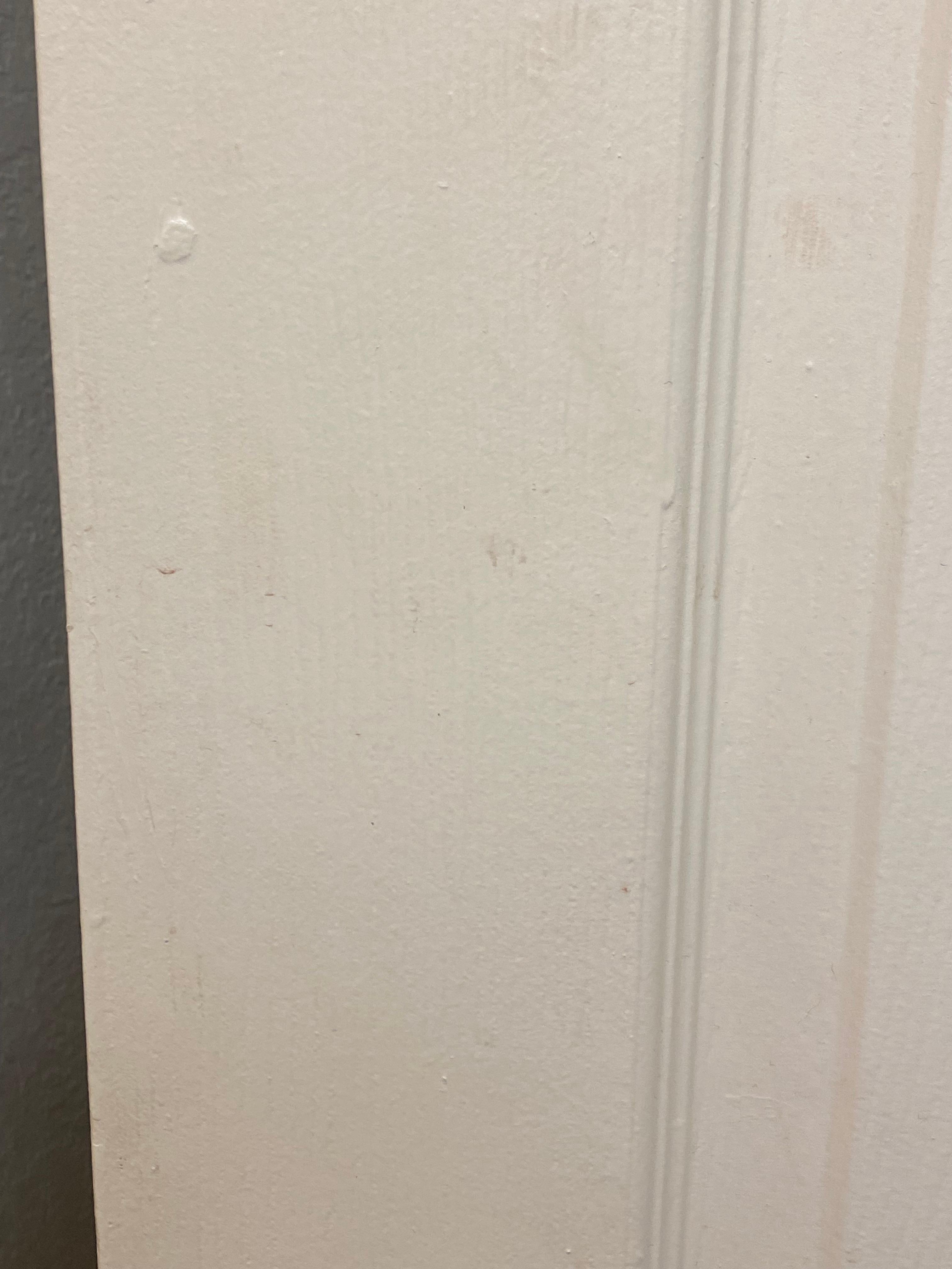 Bathroom door unclean. Can’t tell if someone got sick or if it’s vape residue.