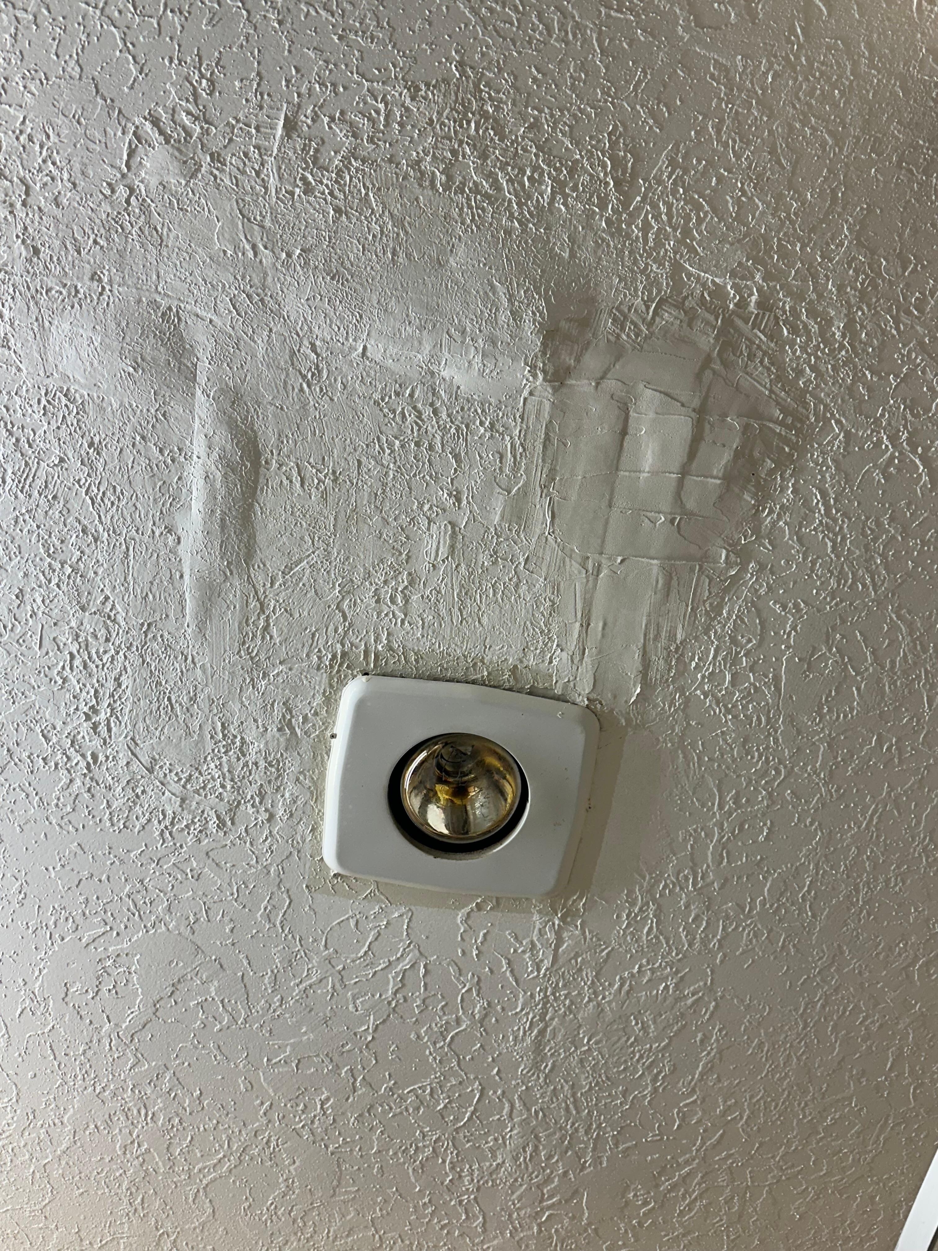 Bathroom ceiling bulb did not actually turn on but fan did. No cover. I could see up through the inside. Bad patch job.
