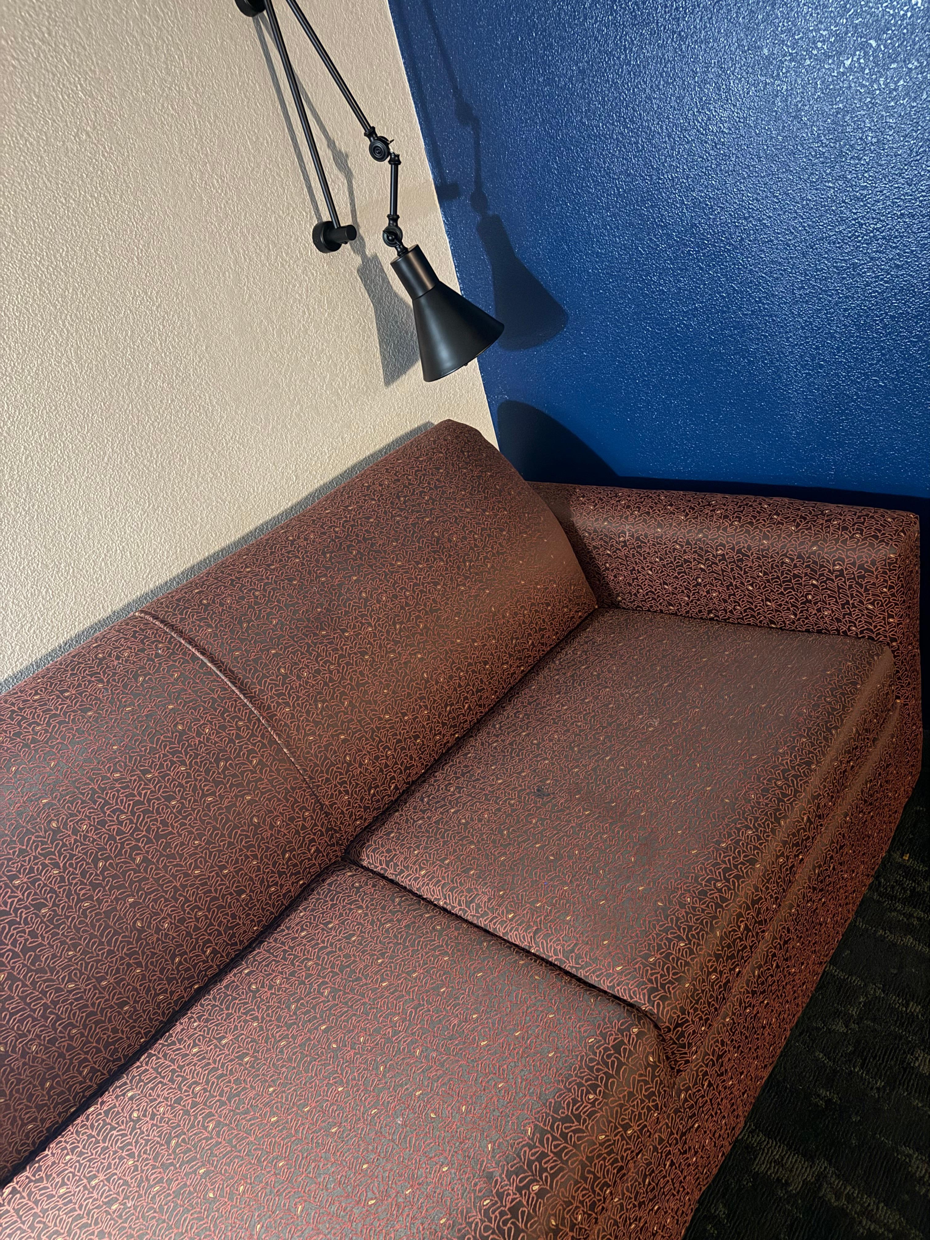 Broken light fixture on the wall. 