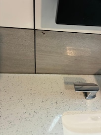 Stuff on the walls next to the mirror