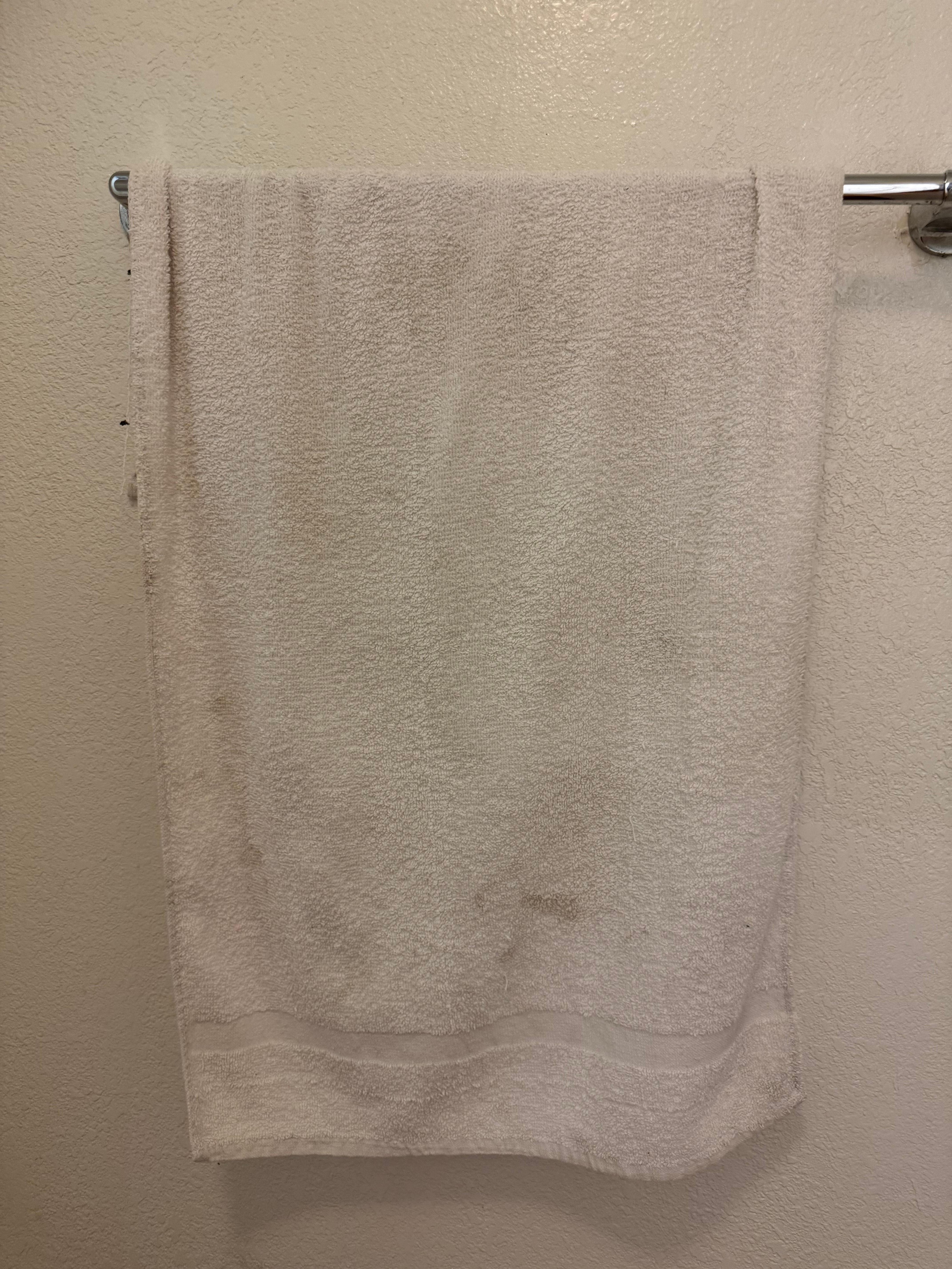 The bath towel was full of stains