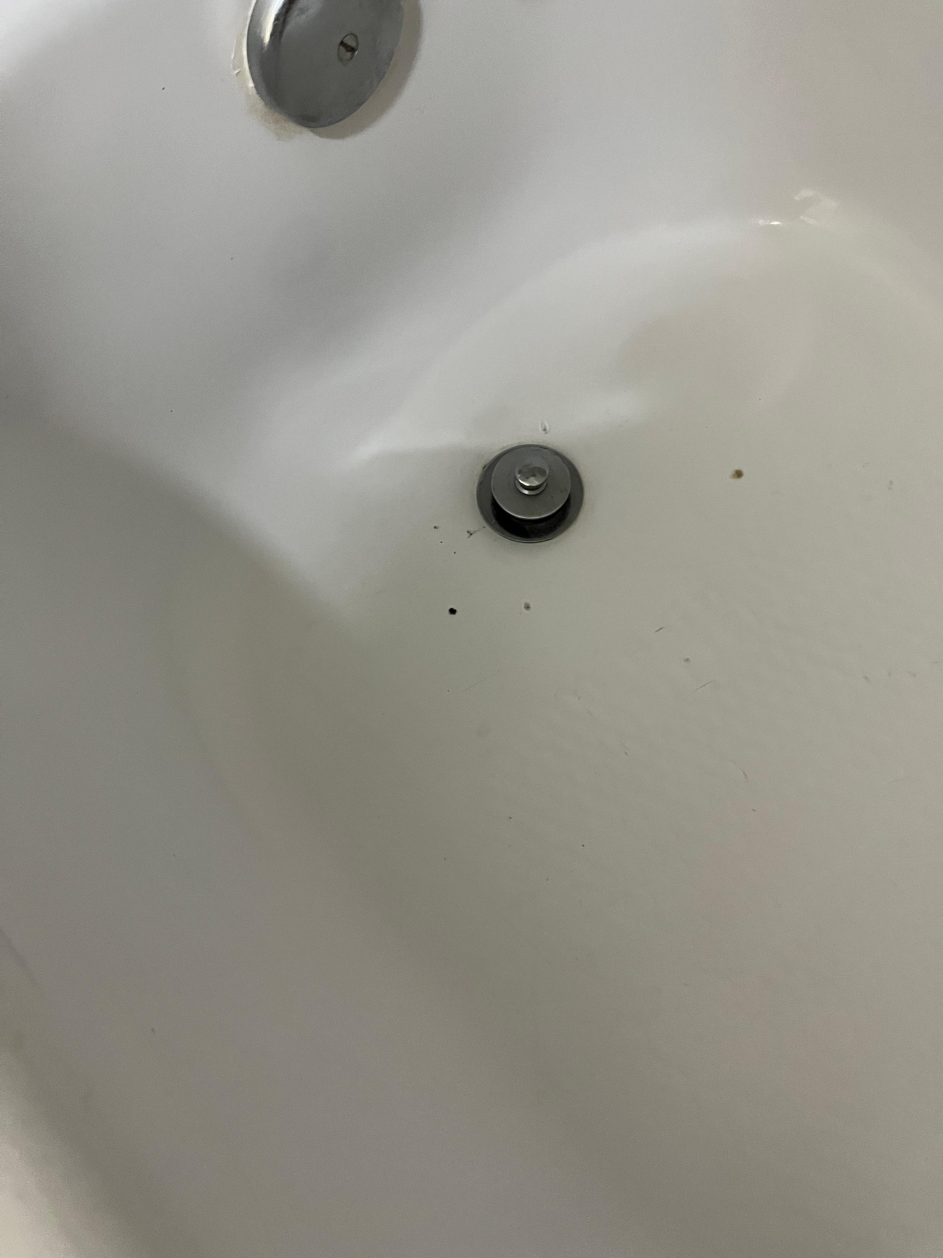 Hair and dirt in tub
