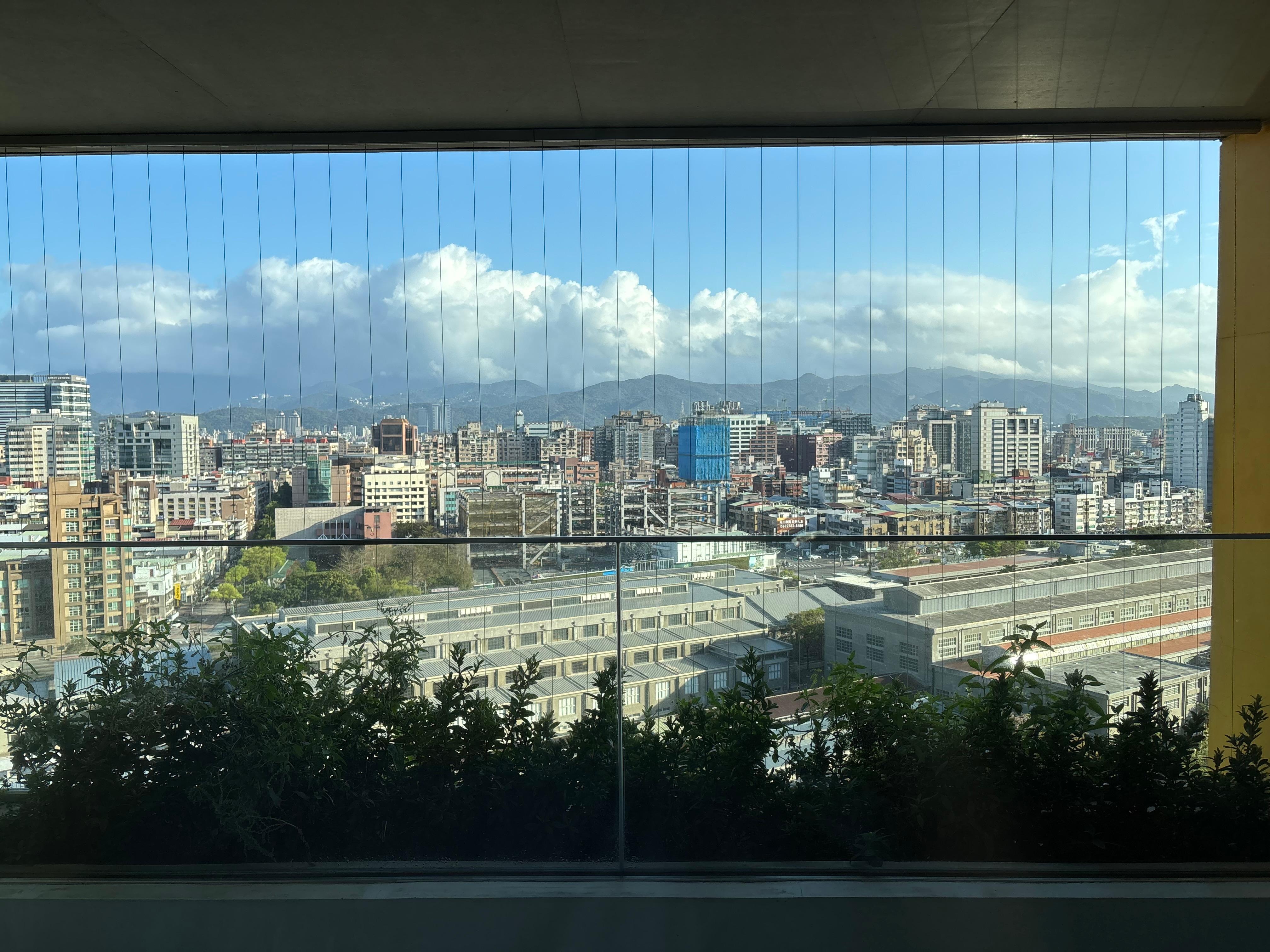 Balcony overlooking highway and mountain. 