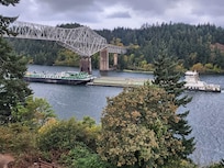 Bridge of the Gods and a barge going under.  From our room balcony
