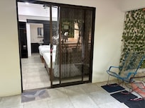 Lanai with hammock and chairs right next to pool