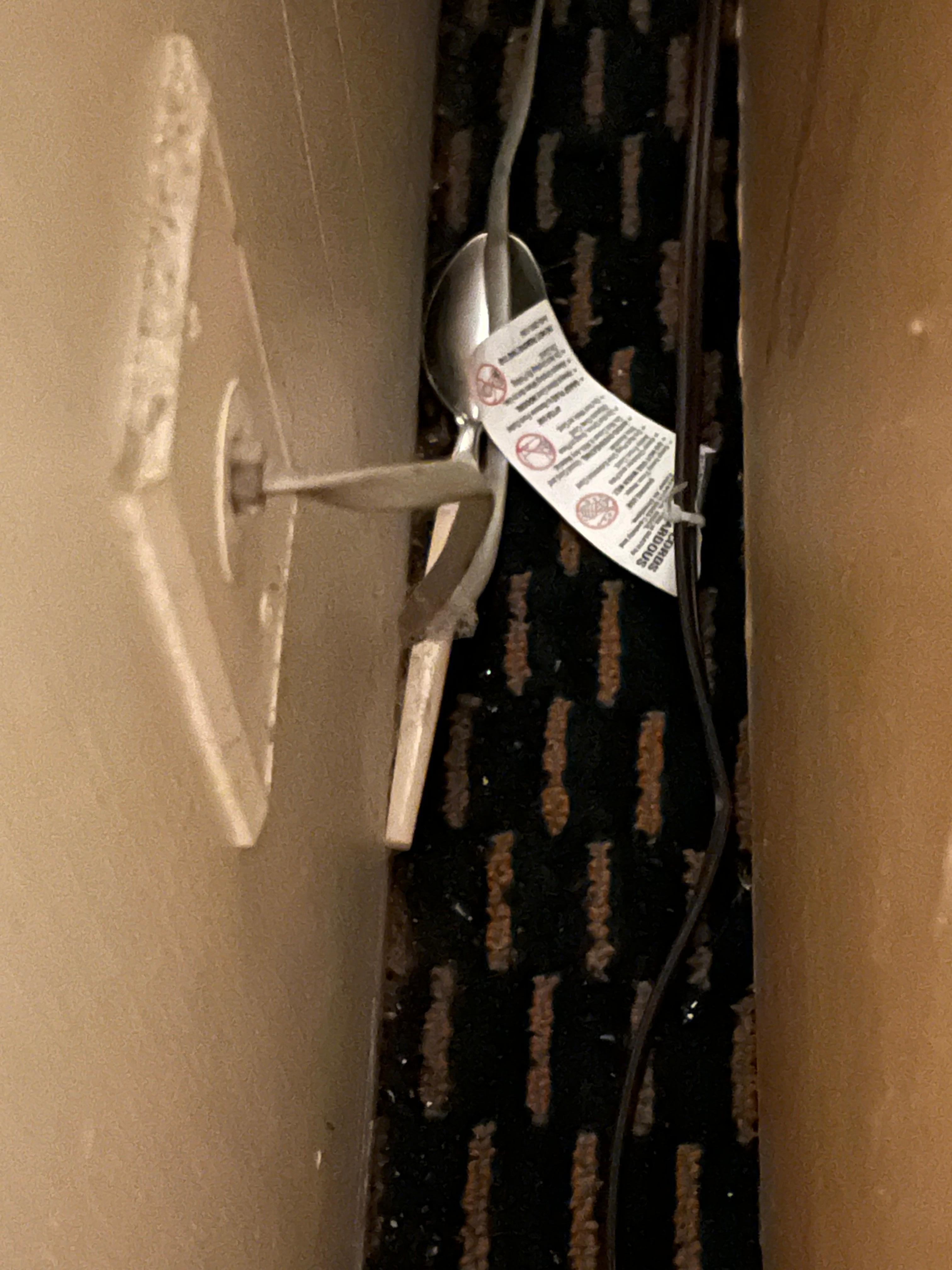 Spoon behind dresser