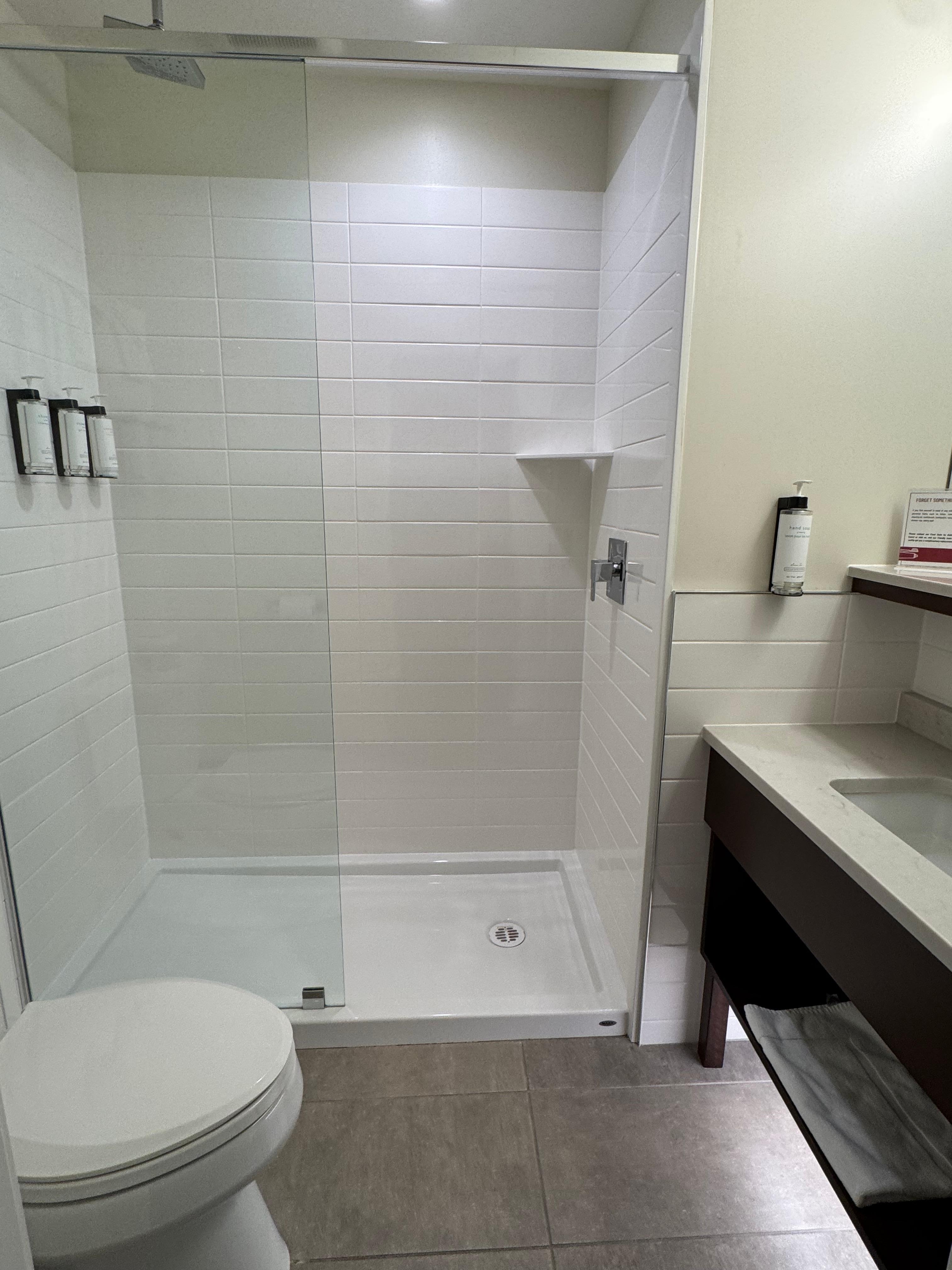 Bathroom with rain shower head very clean.