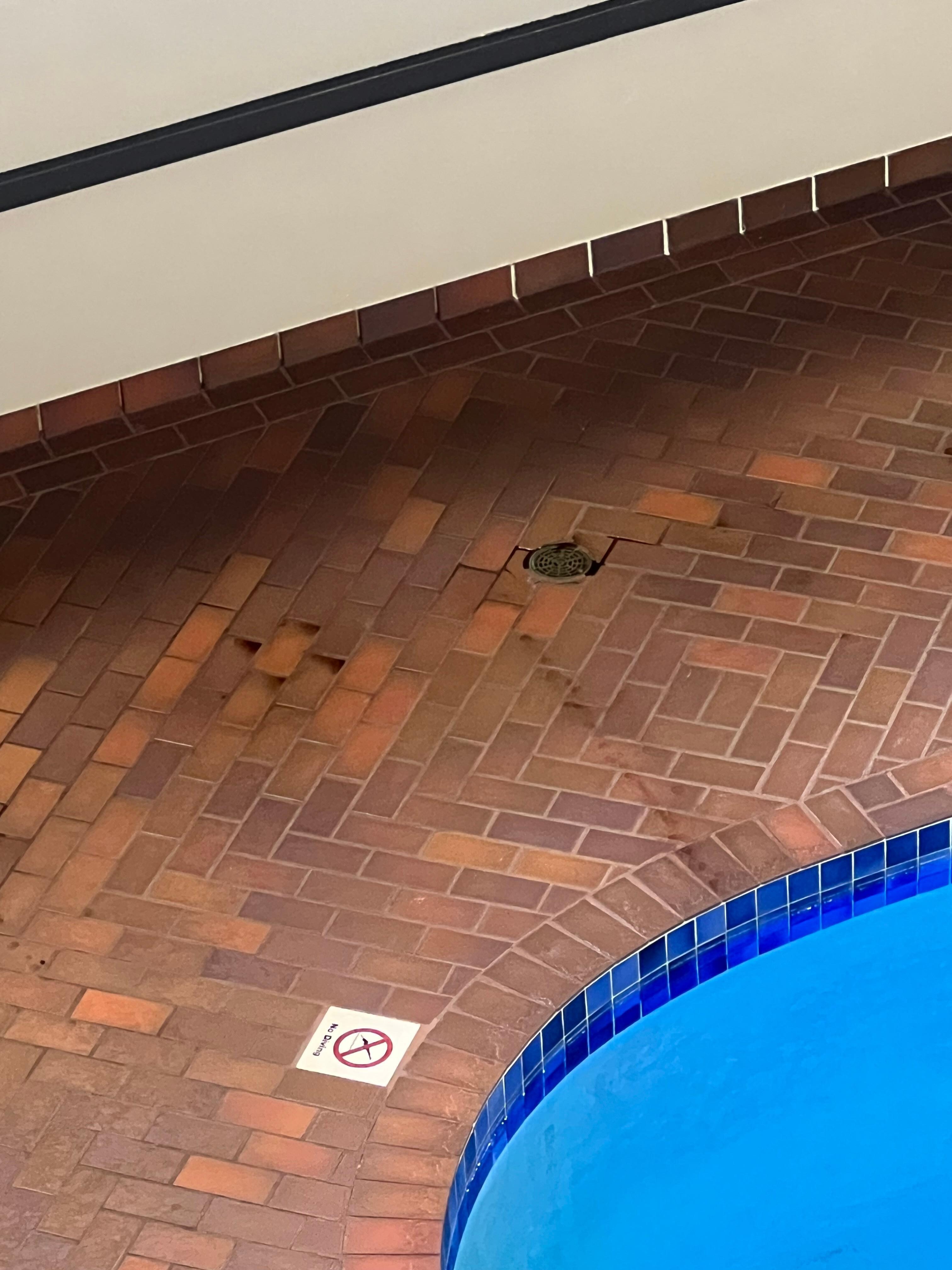 Black liquid from the roof in the floor of the pool