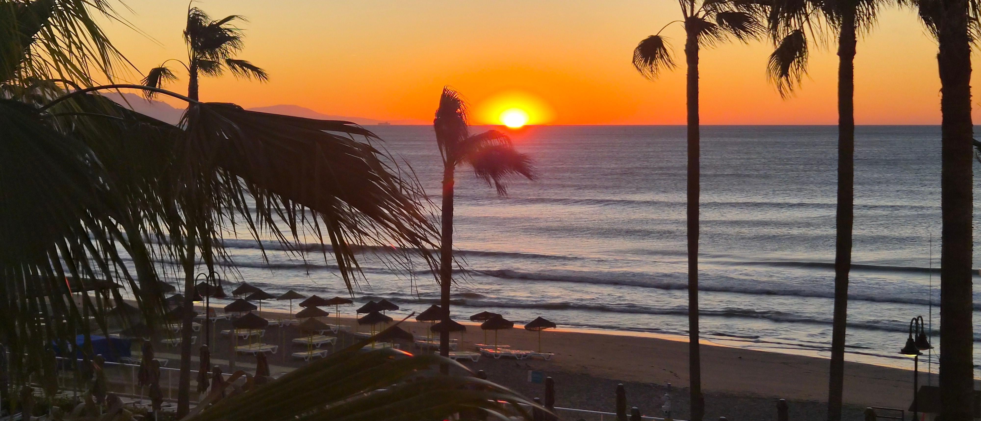 View of the sunrise from my hotel room balcony