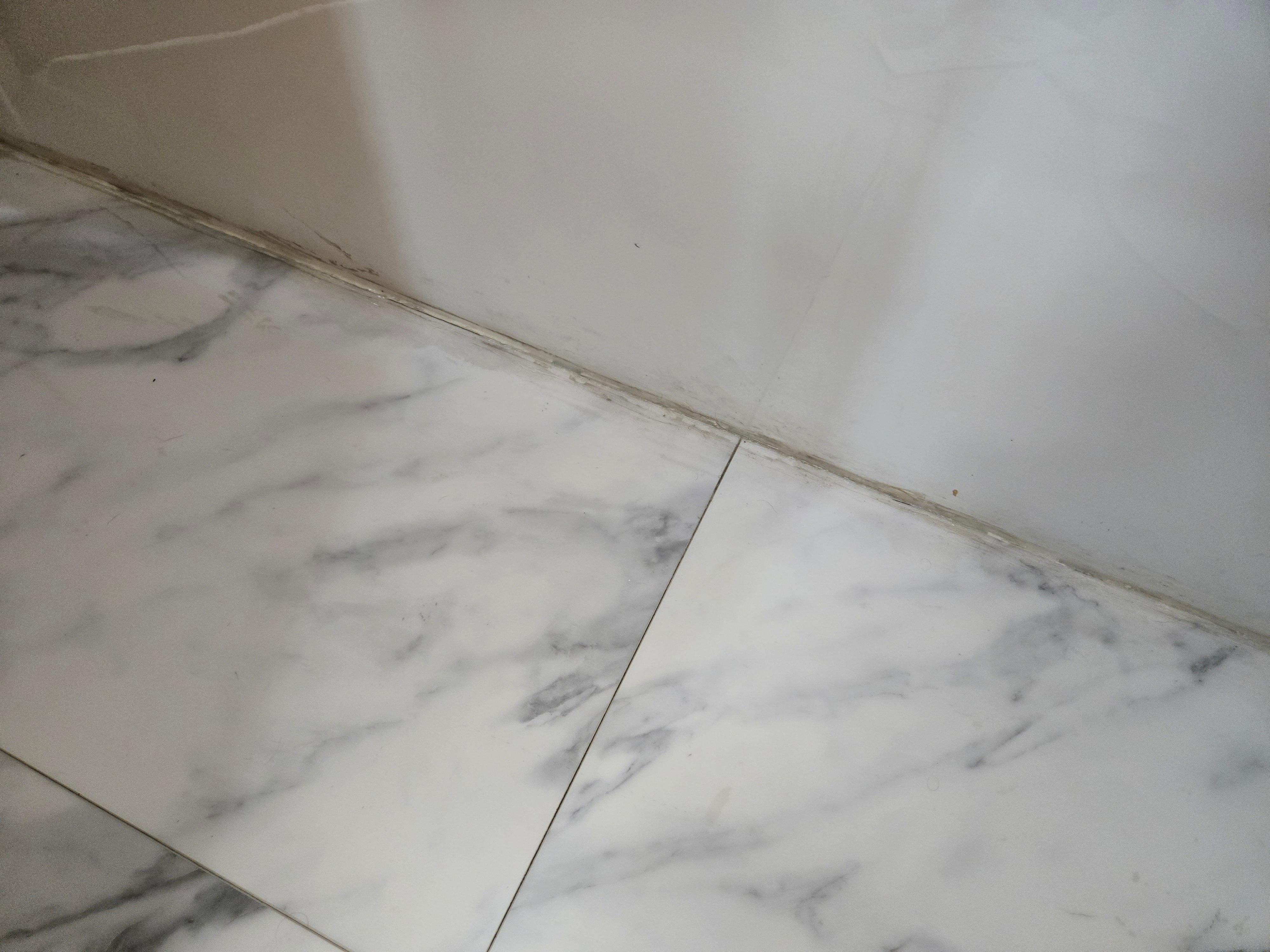 All flooring is peel and stick fake tiles that come up when stepped on