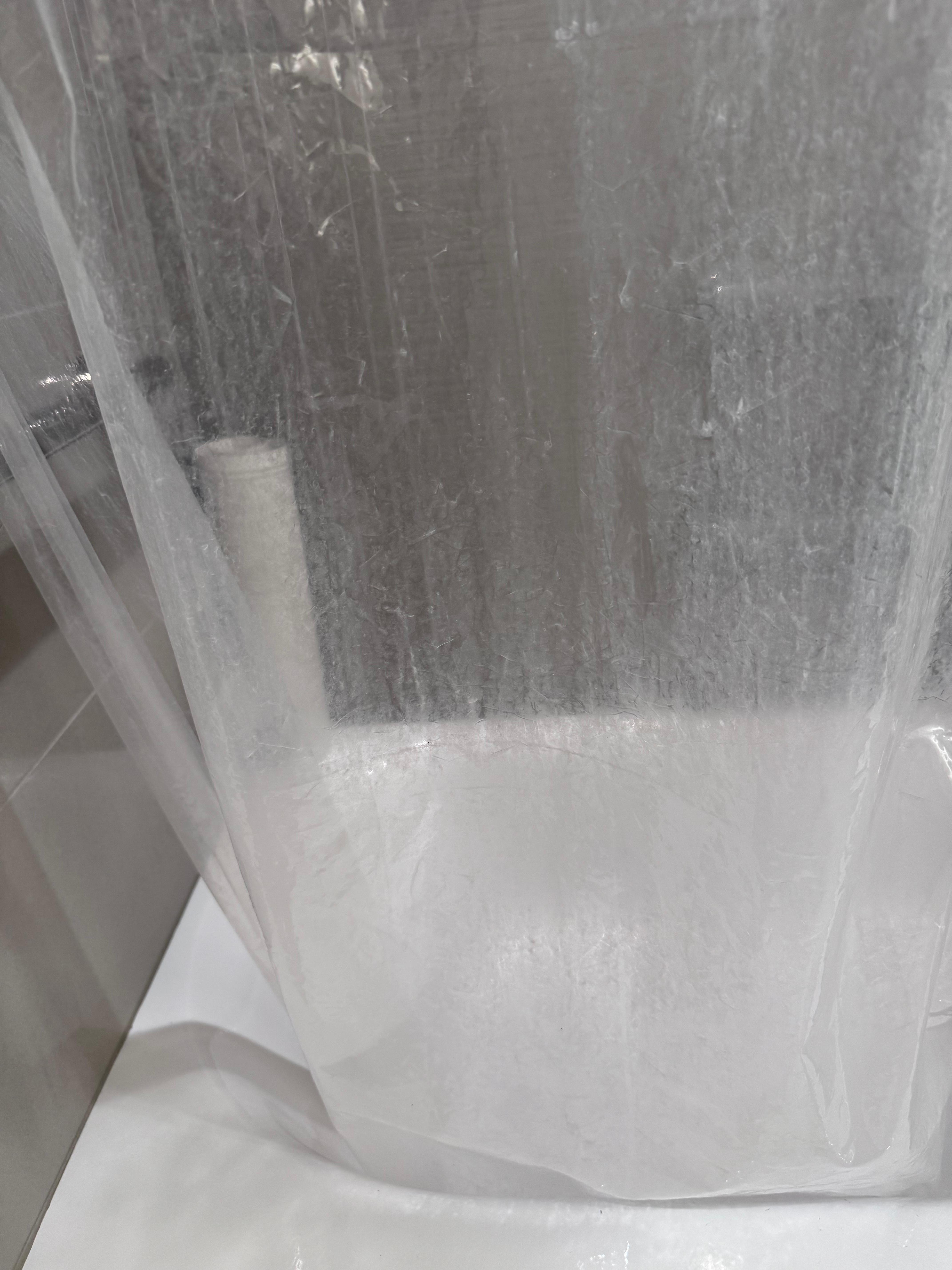 Soap scum all over shower curtain