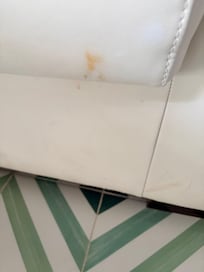 Stained couch in first room