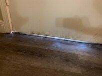 The gaps in the door that led to outside