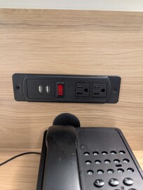 Every plug you need on both sides of bed