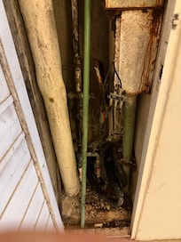 Moldy plumbing closet that connects to the room