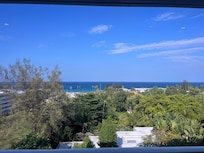 View from hotel room balcony, beach & sea in the distance!!
