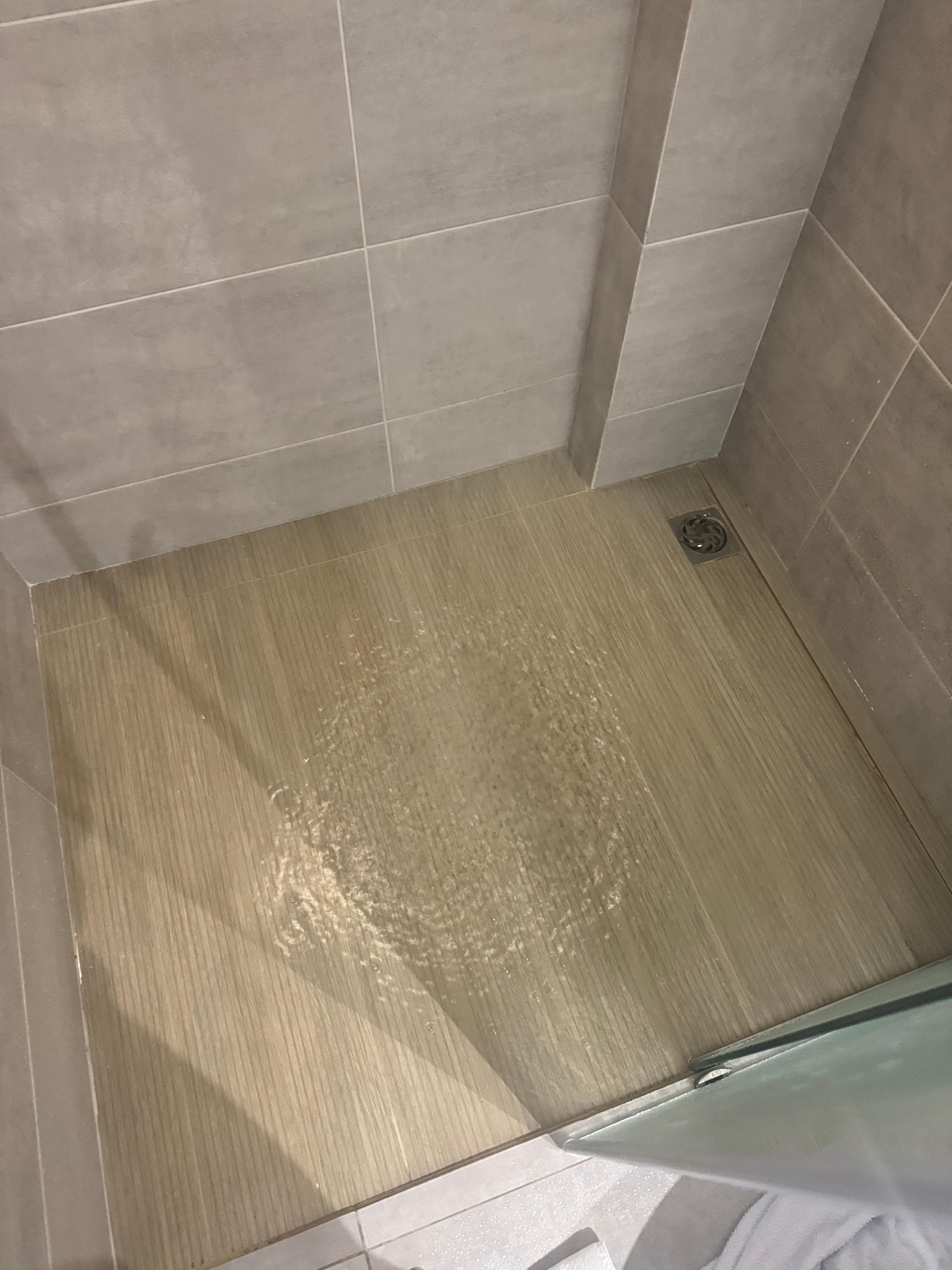 Slow draining shower