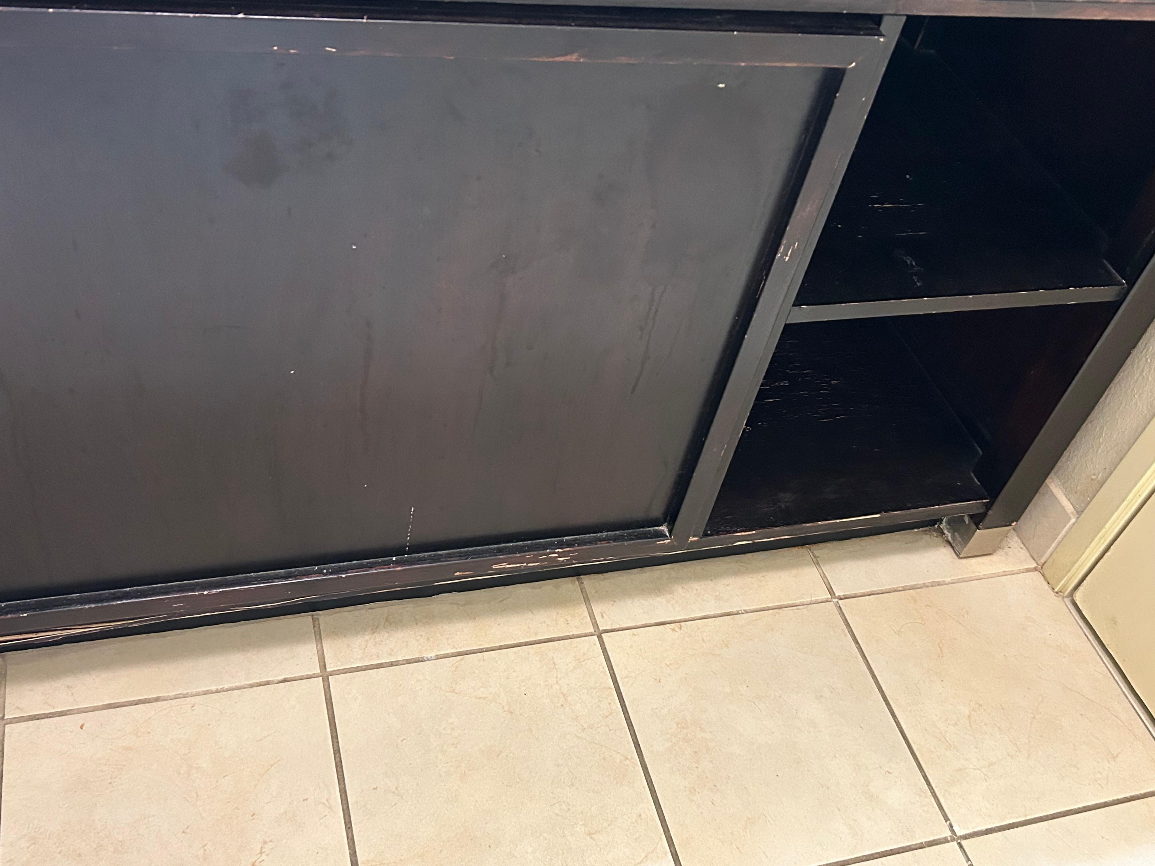 Wood on the cabinet broken and  paint coming off