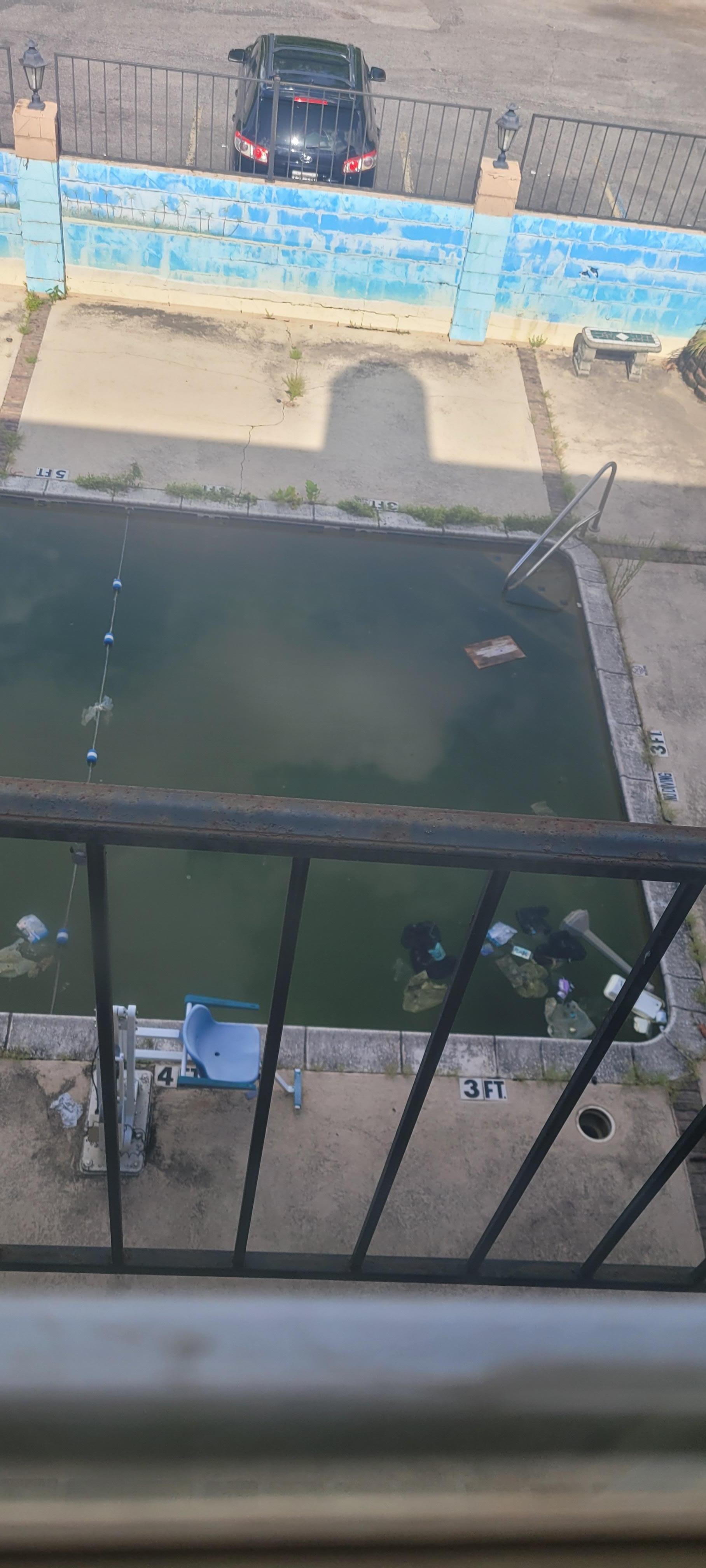 Nasty pool filled with trash