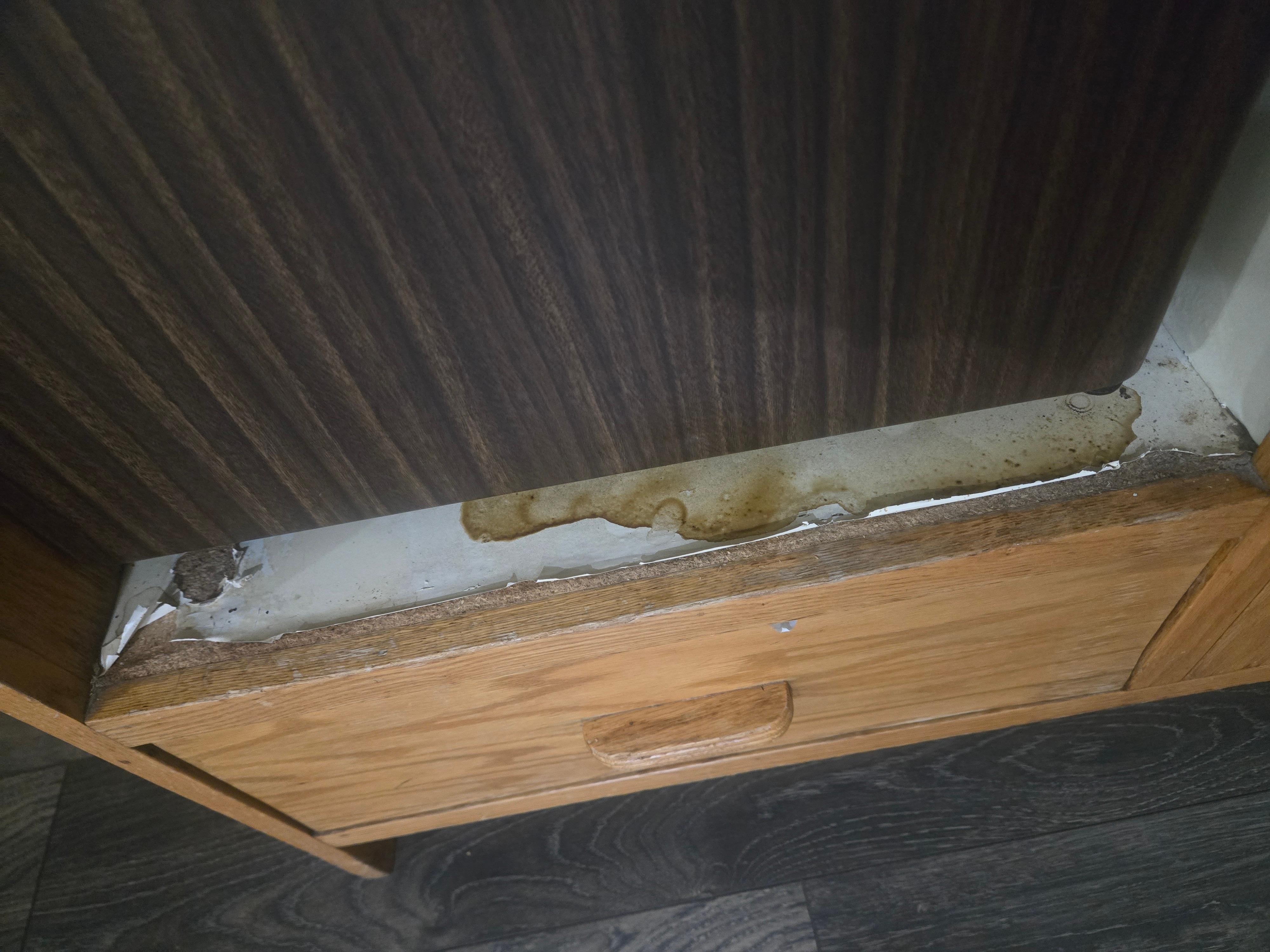 A mystery stain next to the fridge