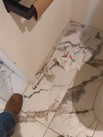 Horrible dirty paper towels on floor