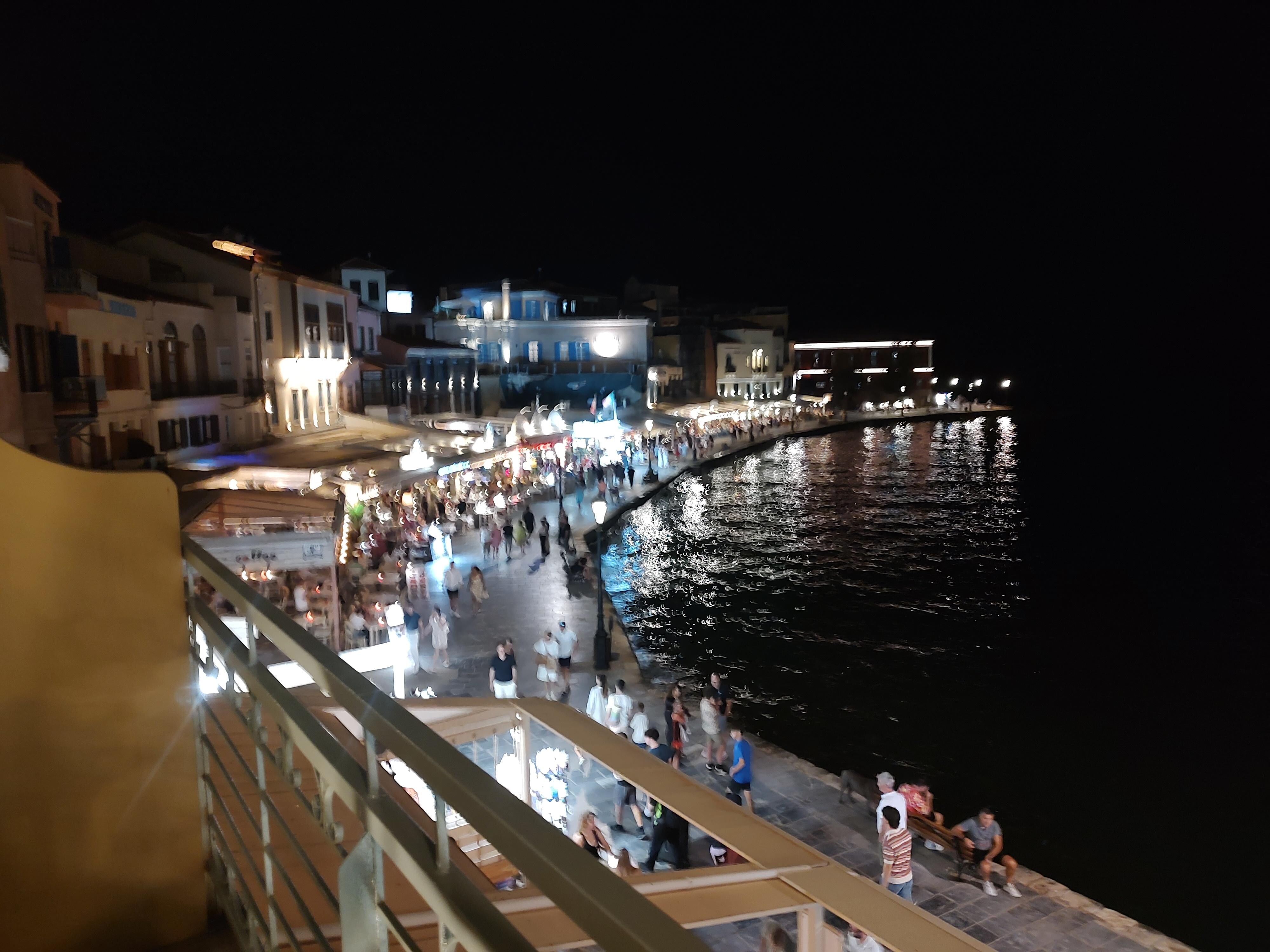 Harbor at night to the left of hotel balcony 