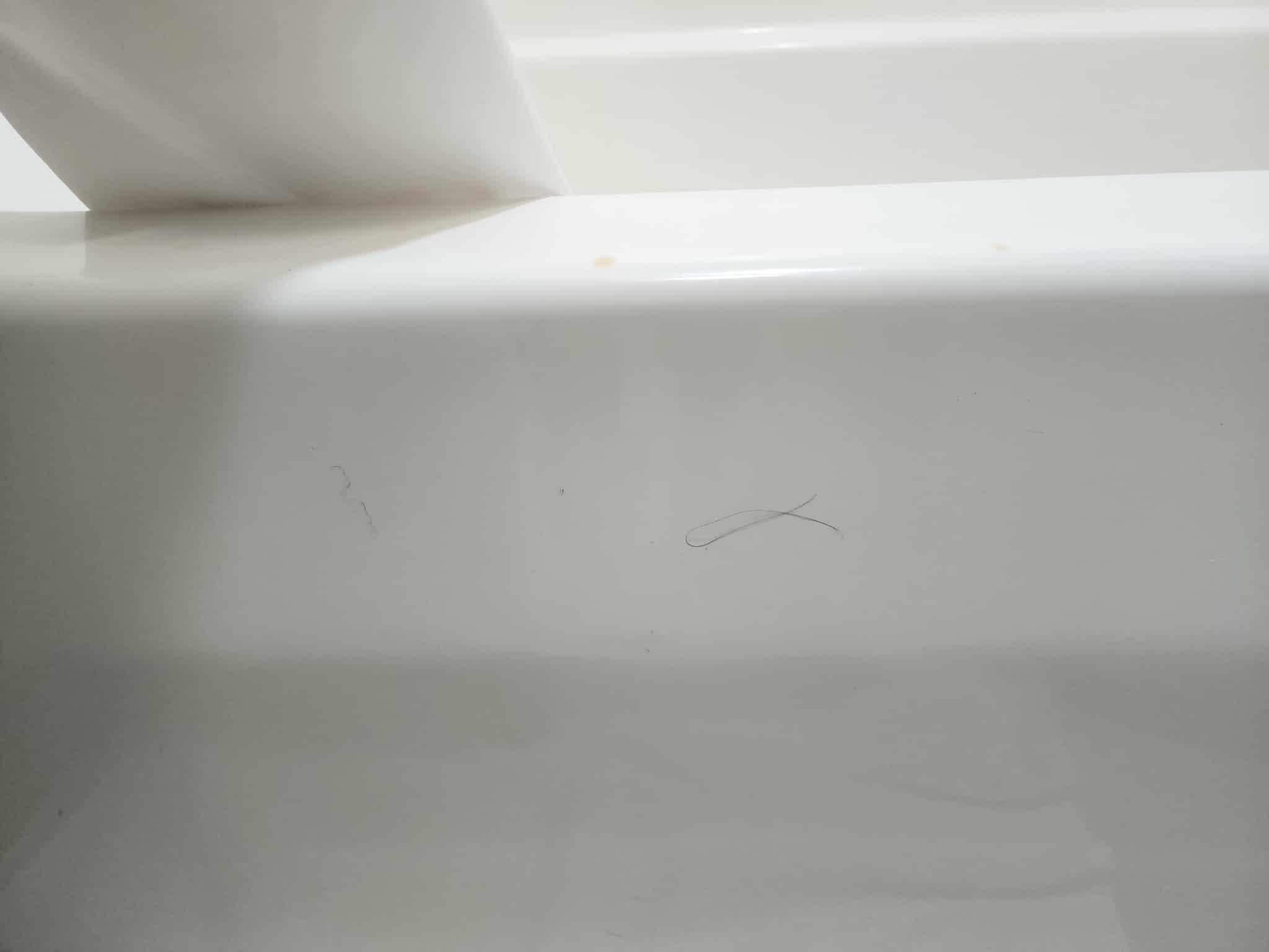 More hair on side of bathtub 