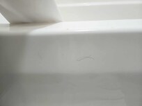 More hair on side of bathtub