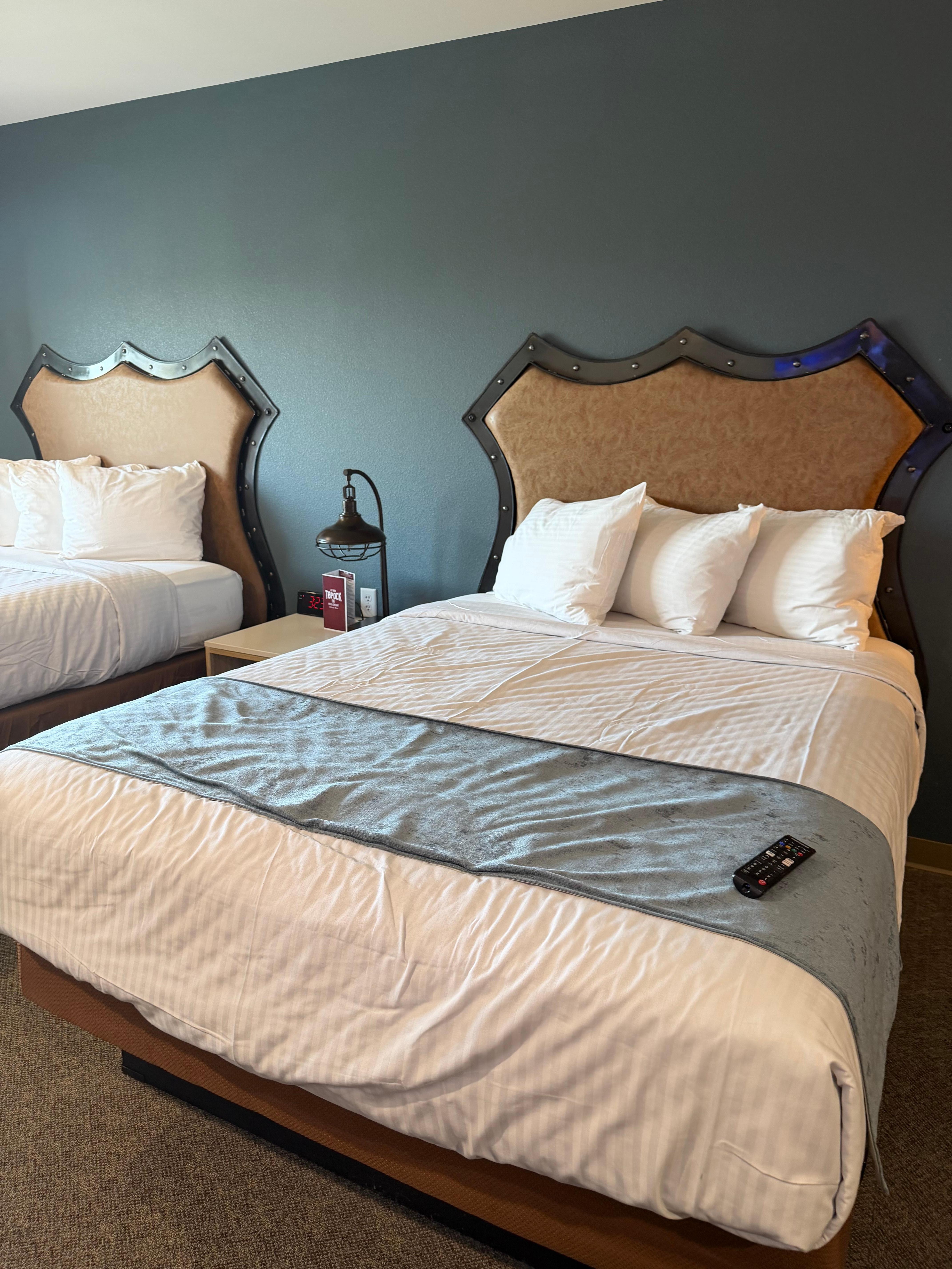 The bed headboard is shaped like Route 66 sign