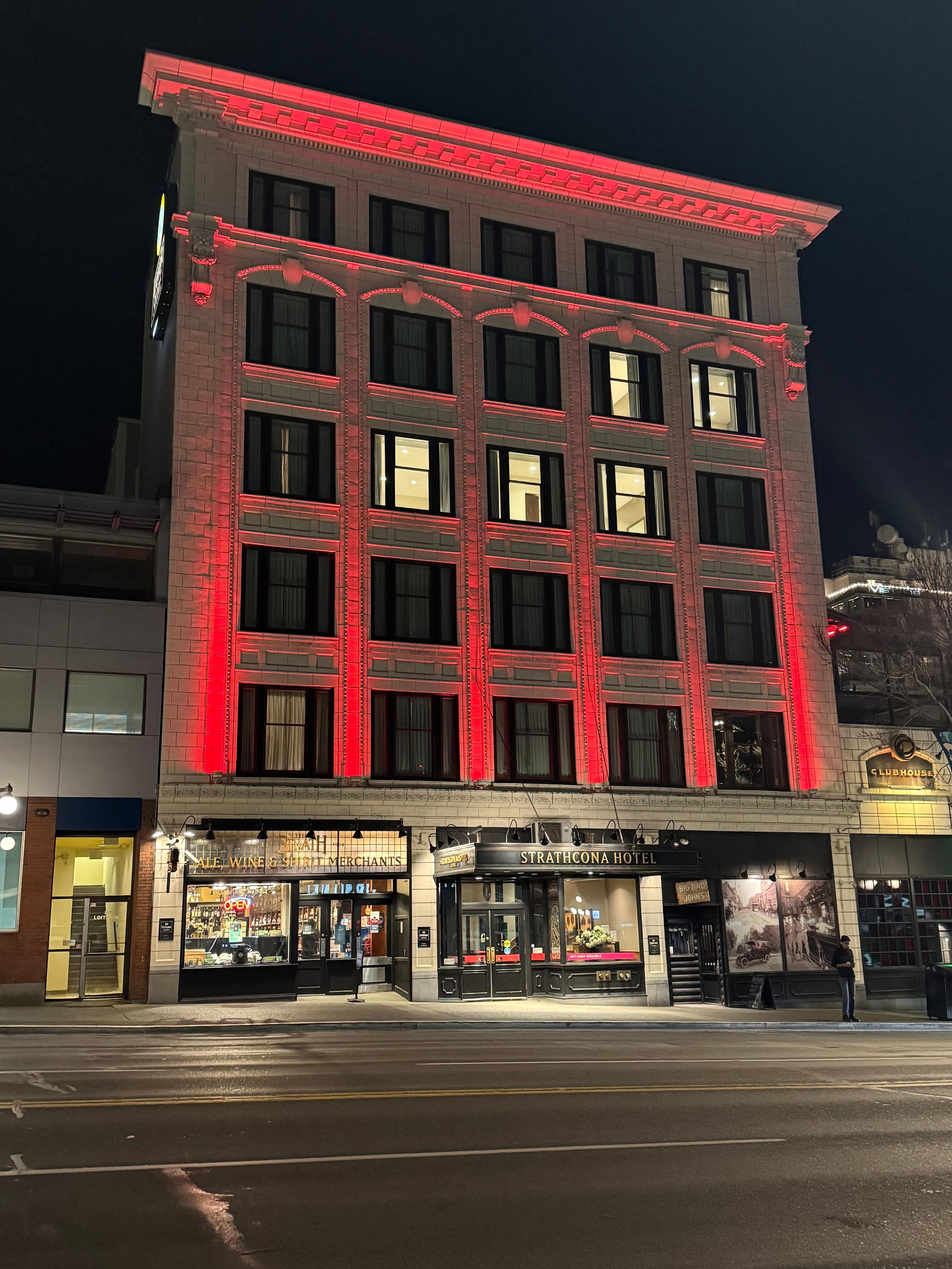 Outside hotel on a Main Street.  Hotel has a pub and liquor store attached.