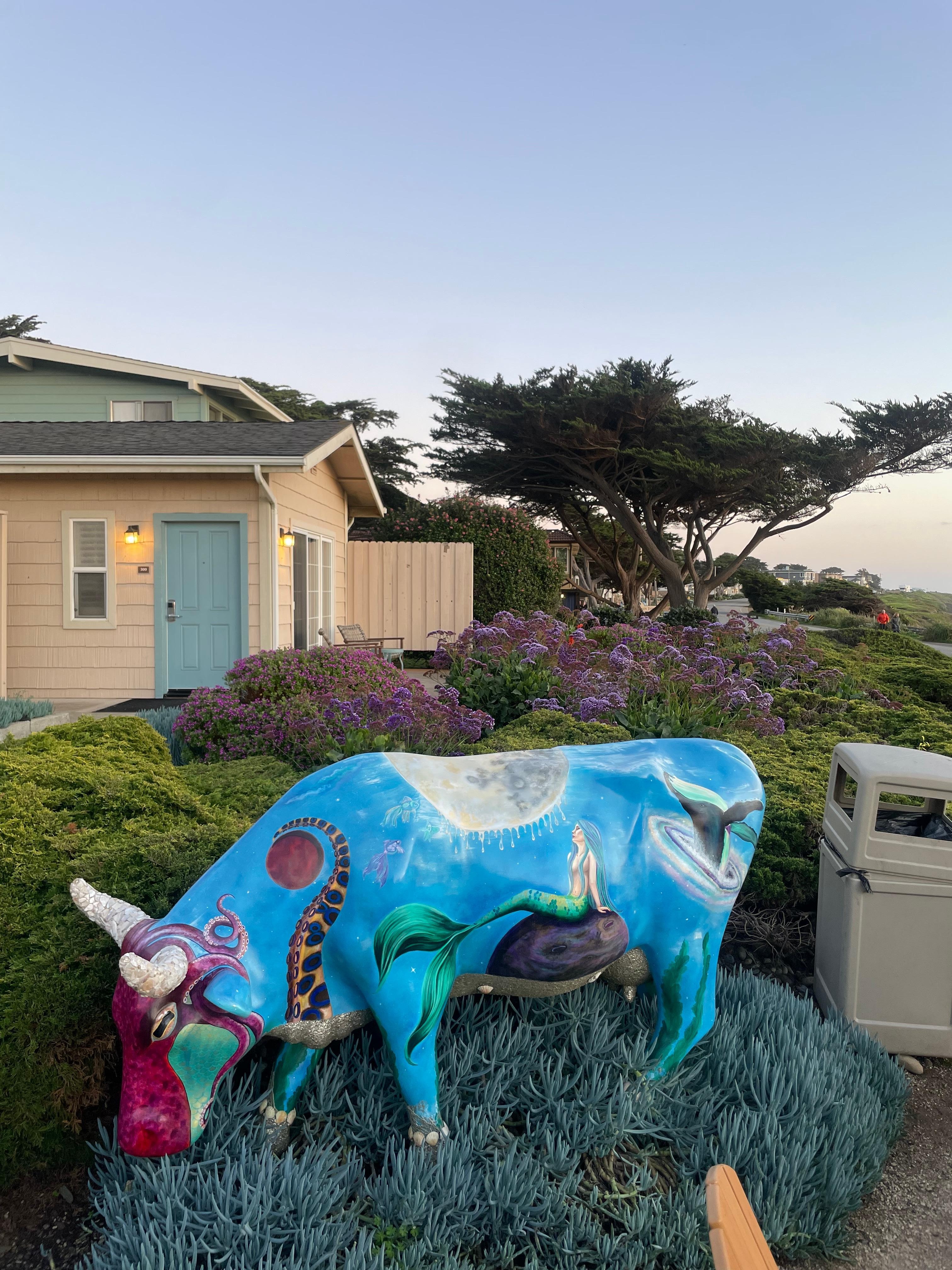 Exterior view of room and nearby art + seating area