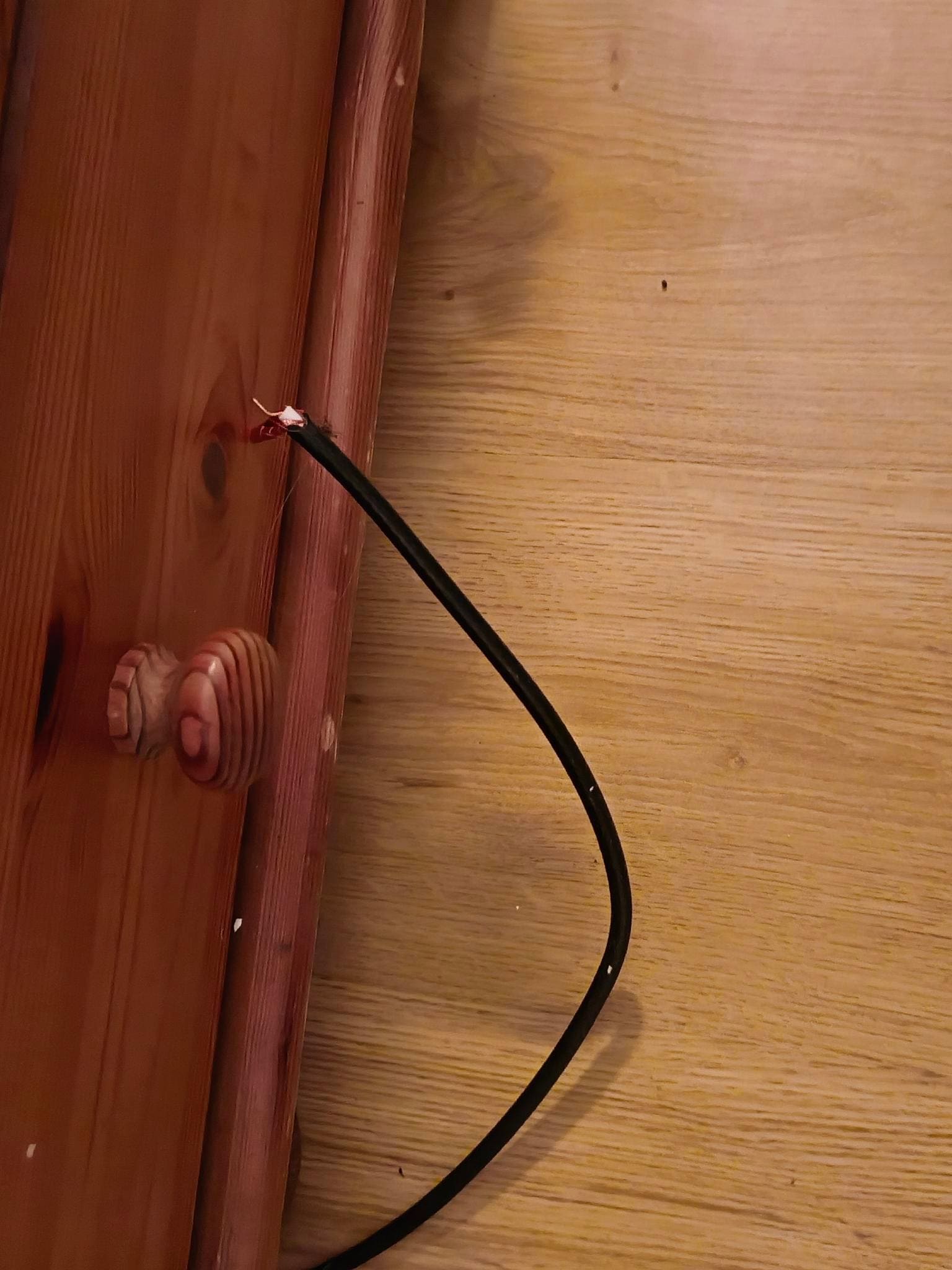 TV Arial cable missing fitting and left lying on the floor