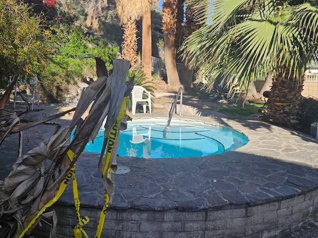 Hot tub area with overgrown landscaping