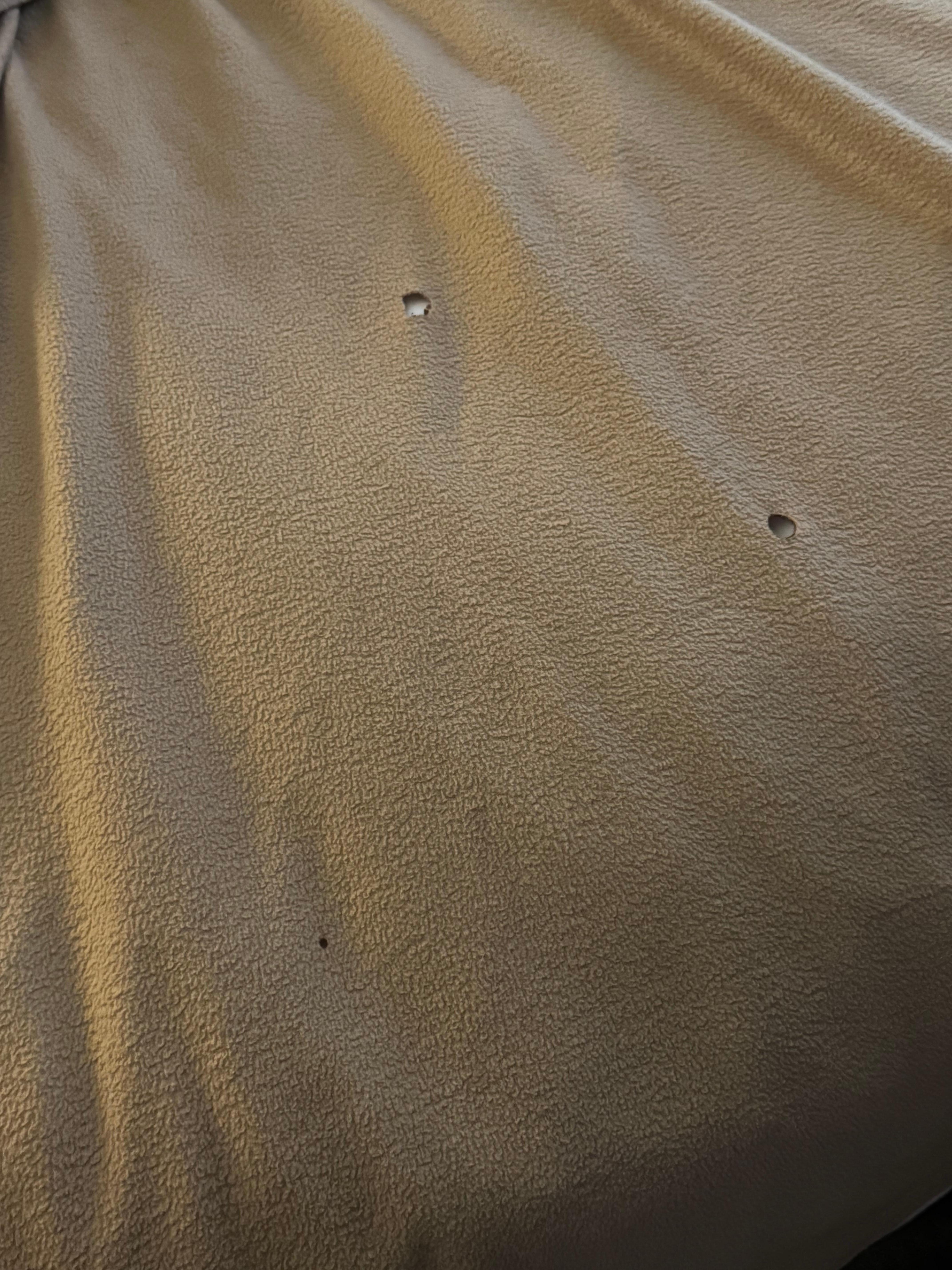 Cigarette burns in our blankets 