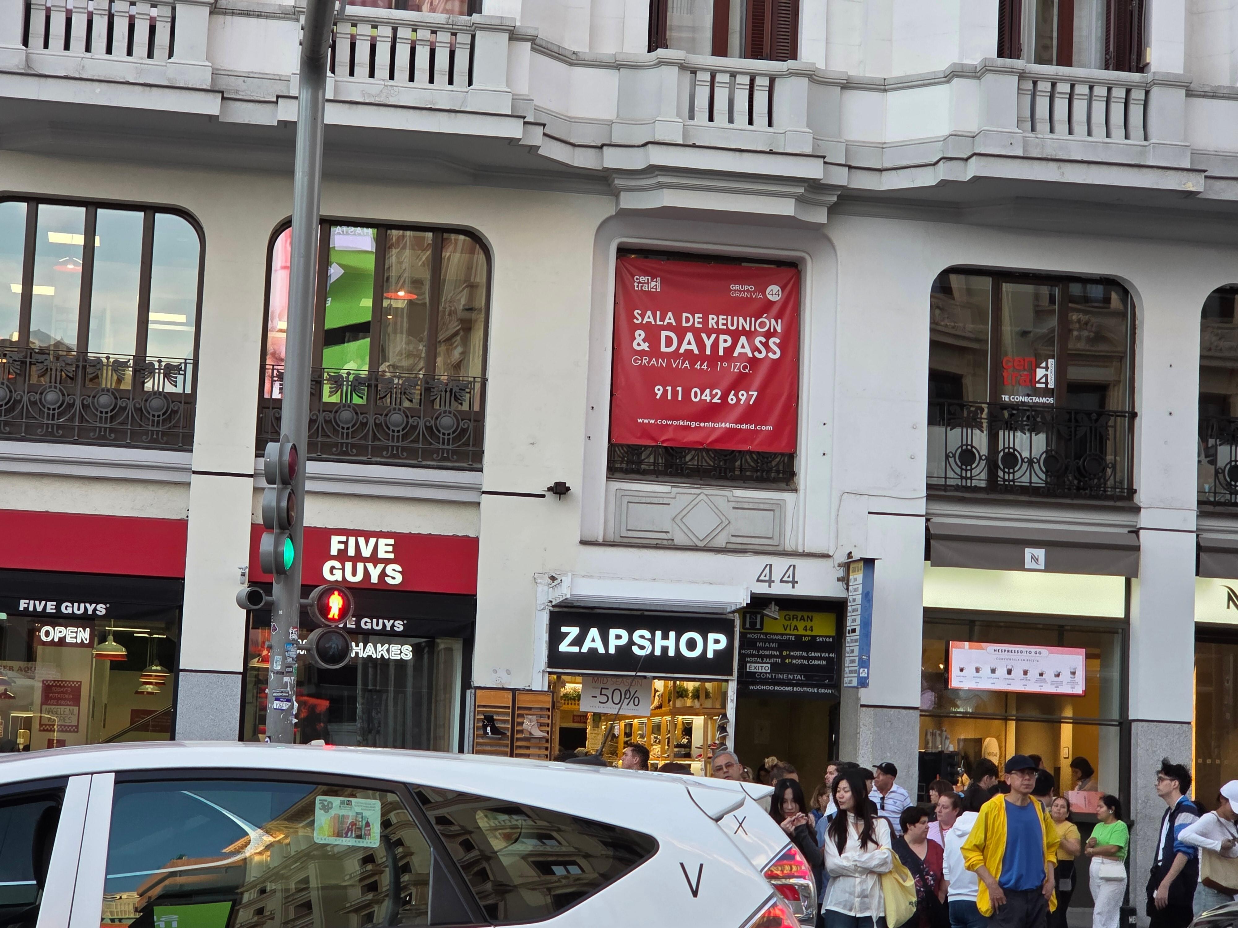 Building front; above a 5 Guys and Nespresso store