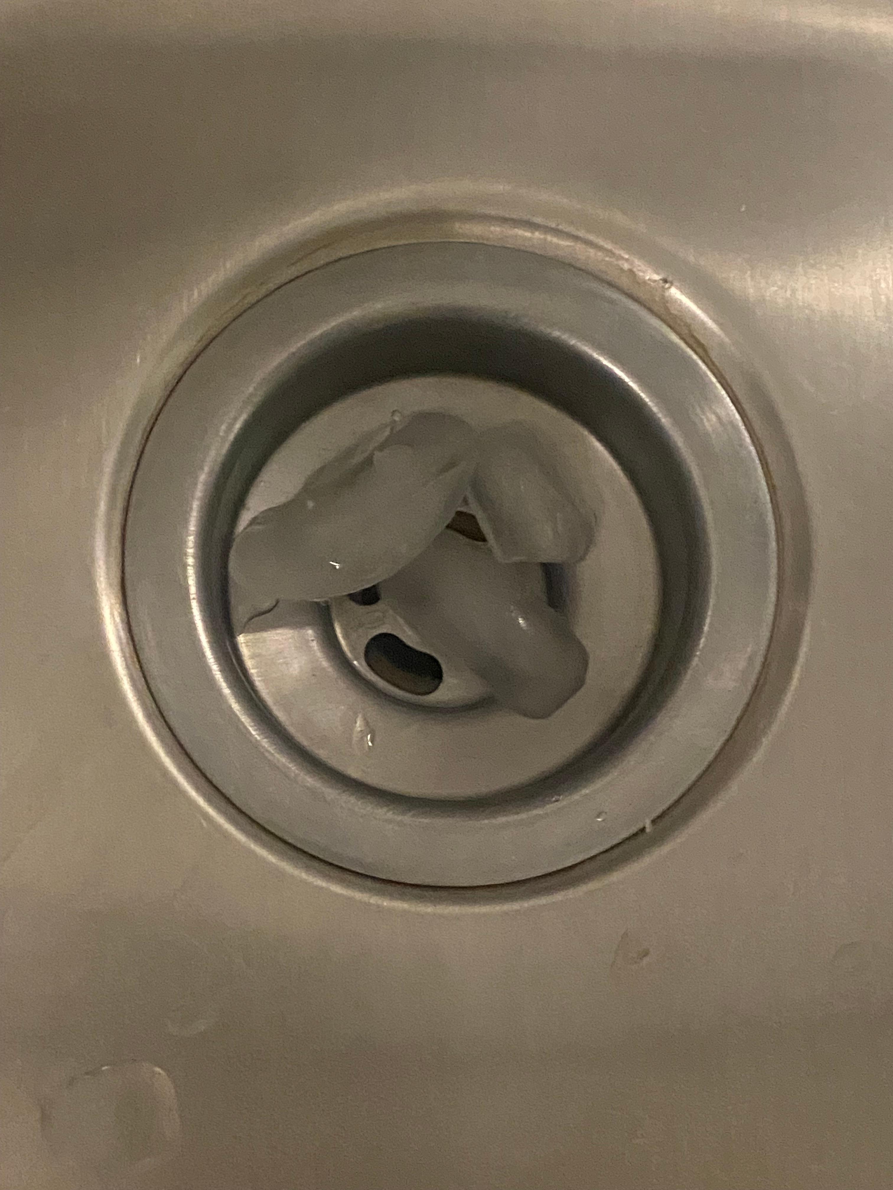 Ice and food particles still in the sink