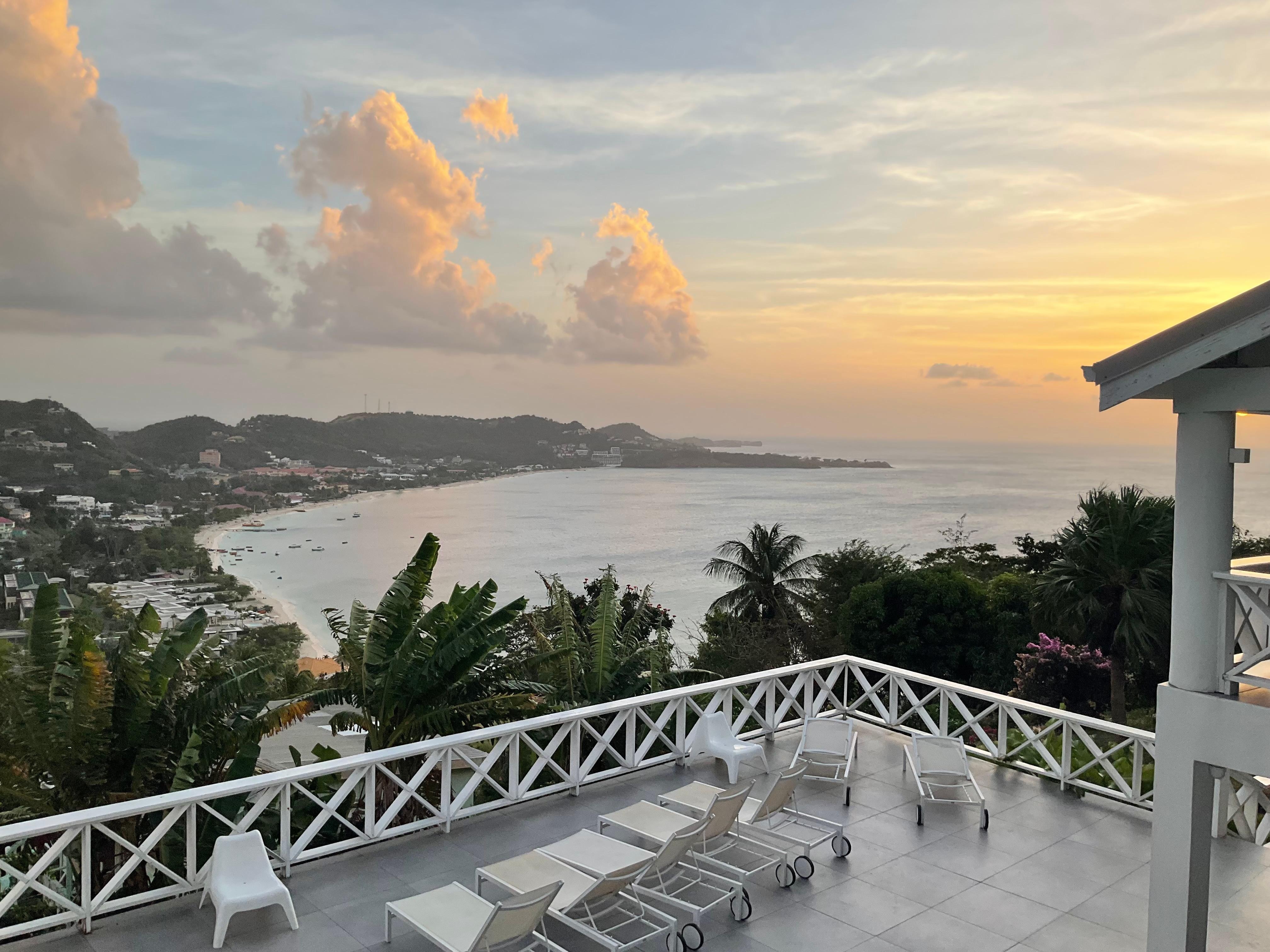 View of the downstairs patio and pool area and the bay.