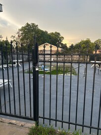 Pool locked with pad lock and chain. Water is green. Manager says they don't use the pool/