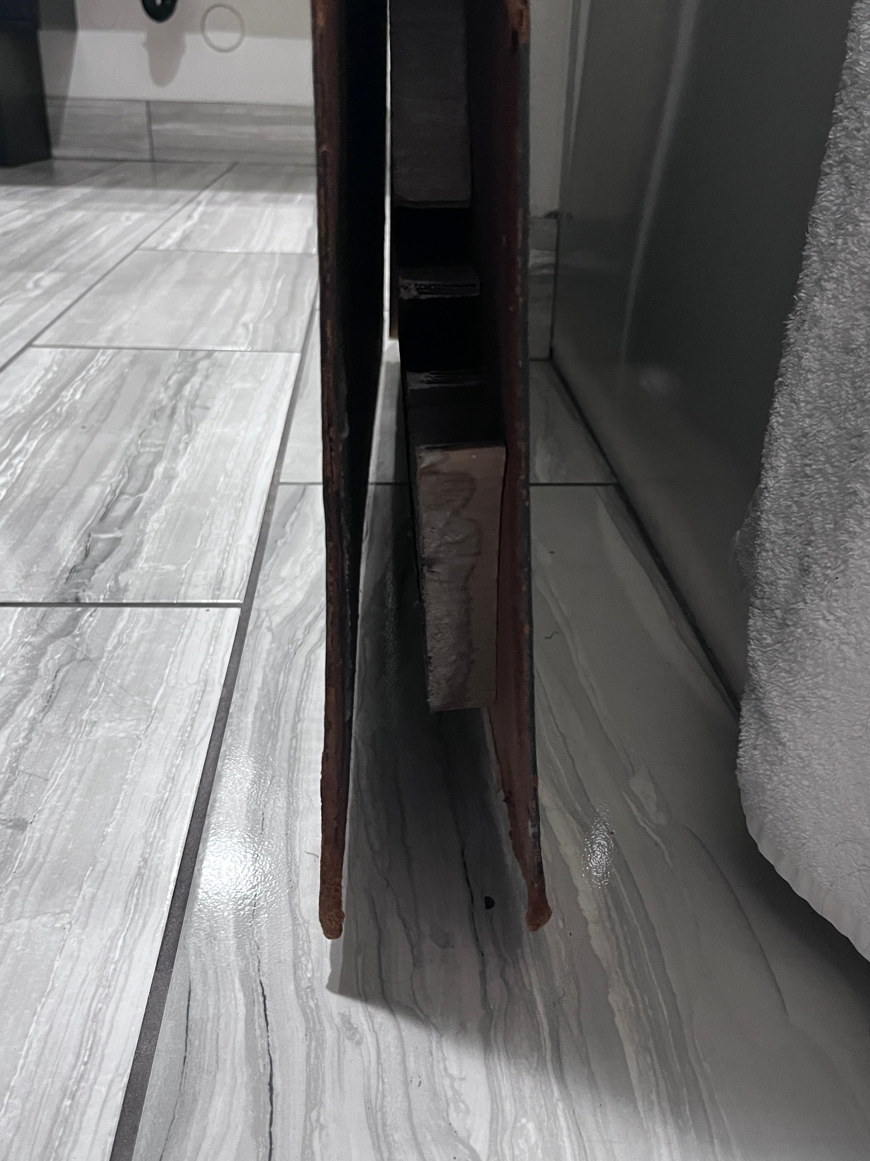 Bathroom door was rotting from the bottom up. Probably because the rod holding the urine smelling shower curtain was installed properly