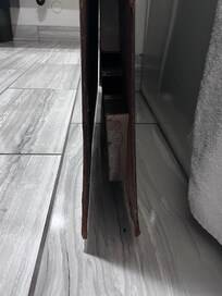 Bathroom door was rotting from the bottom up. Probably because the rod holding the urine smelling shower curtain was installed properly