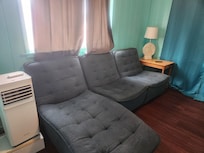not a pullout couch and not held together between cushions. cannot comfortably sleep on this