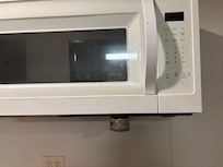 Part of microwave falling out of bottom